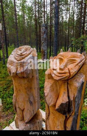 Wooden sculptures displayed outdoors at the Siida Museum in Inari ...