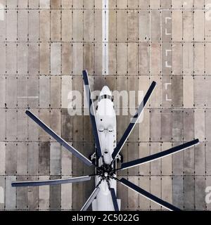 Heavy transport helicopter aerial view. loading equipment on the runway ...