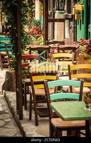 Closeup of chairs from a restaurant located in the old city of Limassol ...
