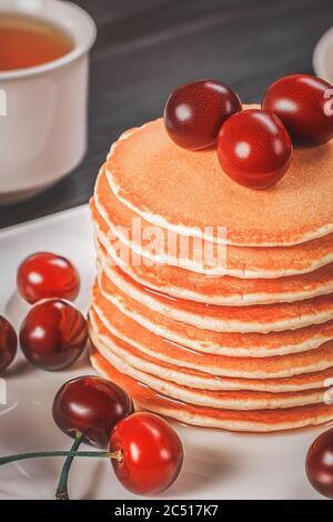 Composition with sweet cherry jam on light background Stock Photo - Alamy