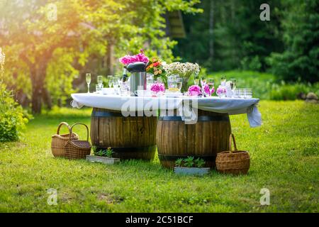 Beautiful catering banquet buffet table decorated in rustic style in the garden. Different snacks sandwiches and cocktails. Outdoor Stock Photo Alamy