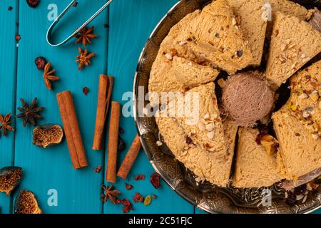 Turkish halva national dessert on blue wooden table Stock Photo - Alamy