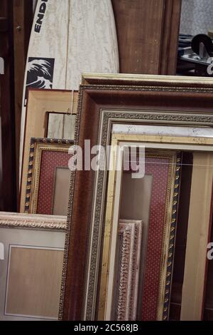 Vertical shot of different old frames on the ground at daylight Stock ...