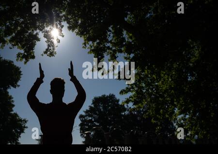 Stuttgart, Germany. 01st July, 2020. Eric and Sheela do the yoga ...