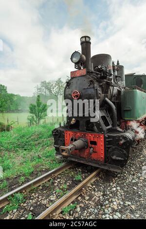 runaway train.old locomotive steam powered Stock Photo - Alamy