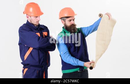 Adjustments concept. Builder, engineer, architect work on project. Men ...