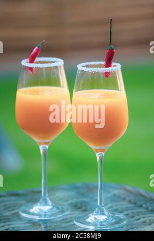Glass of mango chilli martini or cocktail Stock Photo - Alamy