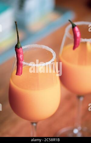 Glass of mango chilli martini or cocktail Stock Photo - Alamy