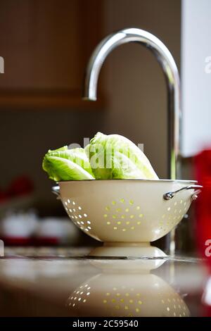 Cabbage soup in bowl over white stone background. Top view, flat lay ...