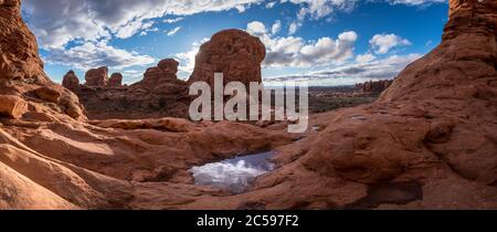 Gorgeous view atop of Turret Arch surrounded by tall sandstone spires ...