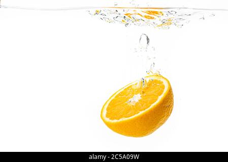 orange with dripping clear juice on white background Stock Photo - Alamy