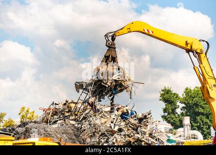 Close-up of a crane for recycling metallic waste Stock Photo - Alamy