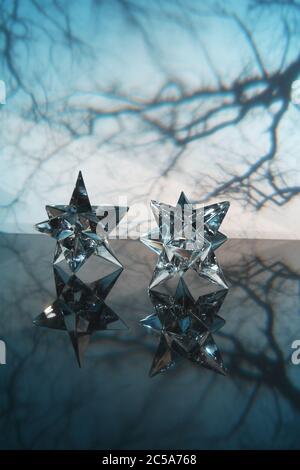 Closeup shot of a crystal figure on a water surface making circle waves ...