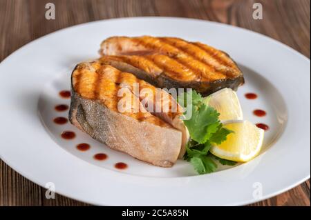 Fried Arctic char fish fillet in breadcrumbs and fresh vegetable salad ...