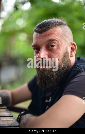 Bearded man, long beard. Brutal caucasian serious hipster with ...