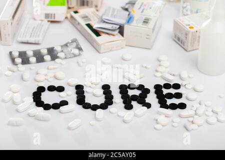 Word PILLS made of assorted pharmaceutical medicine pills, tablets and ...