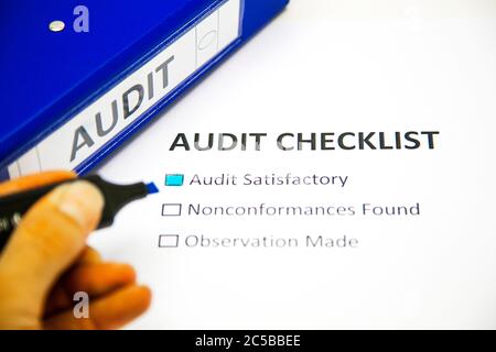 Audit checklist, with tick against "audit satisfactory Stock Photo - Alamy