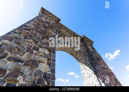 A low-angle of Yellowstone national park view with a lake reflecting ...