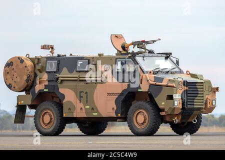 Australian Army soldier with a Bushmaster armored personnel carrier ...