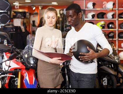 Customer girl is demonstrating purchases in the shop Stock Photo - Alamy