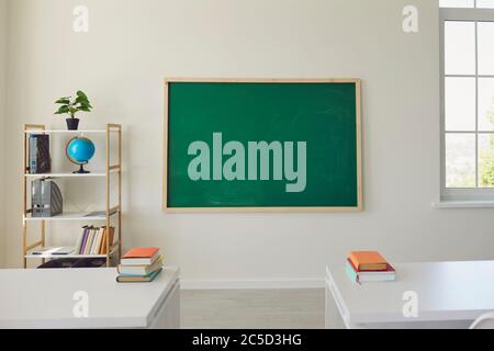Empty white classroom background with green chalkboard table and seat ...