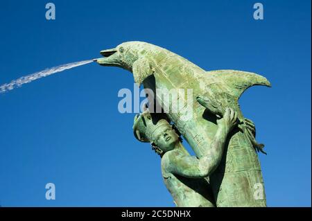 Ancient statue of a poet Arion with a dolphin Stock Photo - Alamy
