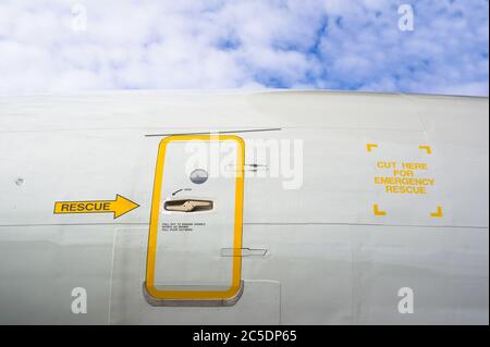 Airplane emergency exit door Stock Photo - Alamy