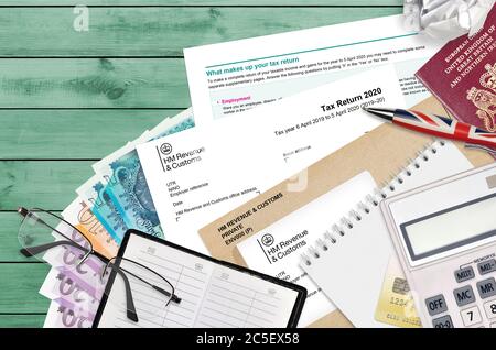English form sa100 Tax return by HM revenue and customs lies on table ...