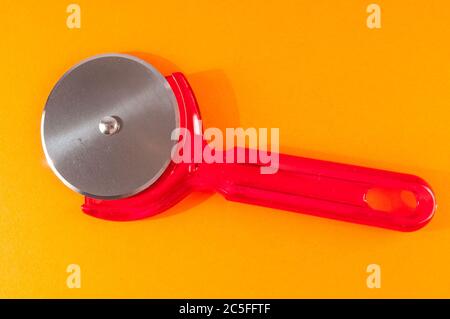 Picture of Plastic Red Pizza Cutter Slicer Knife Stock Photo - Alamy