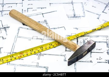 Hammer and yardstick lying on construction plan Stock Photo - Alamy