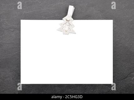Chit and wooden peg on slate board Stock Photo - Alamy