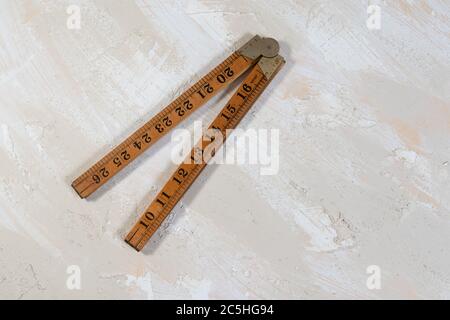 Old school carpenter's three foot folding rule Stock Photo - Alamy