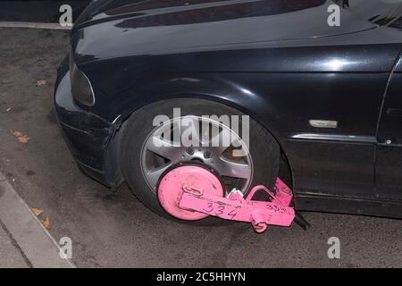 Wheel clamp, wheel boot, parking boot, or Denver boot is a device that ...