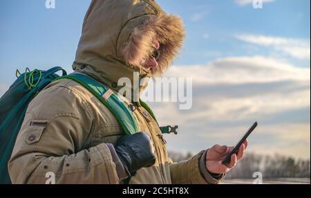 Polar men looks forward against a blue winter sky Stock Photo - Alamy