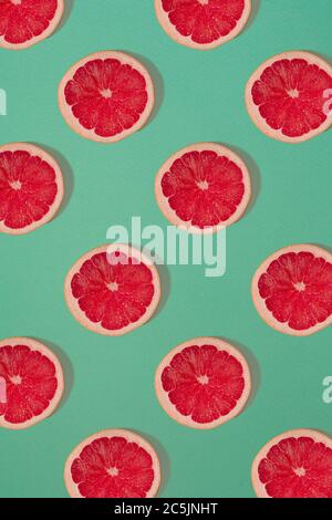 Grapefruit pattern isolated on blue background. Flat lay Stock Photo ...