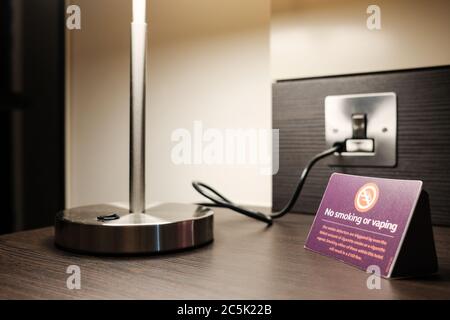 Vaping sign seen on a work desk with a premium-priced hotel room. The ...