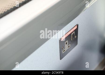 Shallow focus of a UK electrical wall outlet socket located in a ...