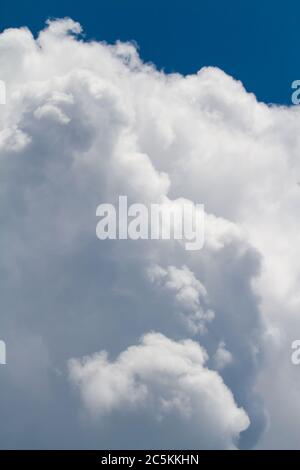 Cumulus clouds with some rain threatening clouds Stock Photo - Alamy