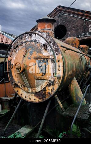 An old, abandoned steam boiler in timber framed shed Stock Photo - Alamy