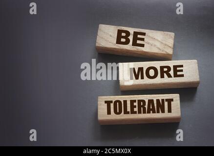 Be More Tolerant words on wooden blocks on dark background. Tolerance ...