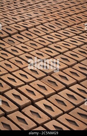 Homemade clay brick making in Uganda. The bricks are dried in the sun ...