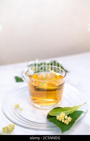 cup of tea with linden flowers on a rustic table Stock Photo - Alamy