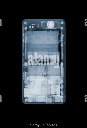 Mobile phone, coloured X-ray Stock Photo - Alamy