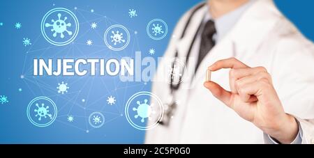 Doctor giving pill with INJECTION inscription, coronavirus concept ...