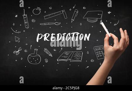 Hand drawing PREDICTION inscription with white chalk on blackboard ...