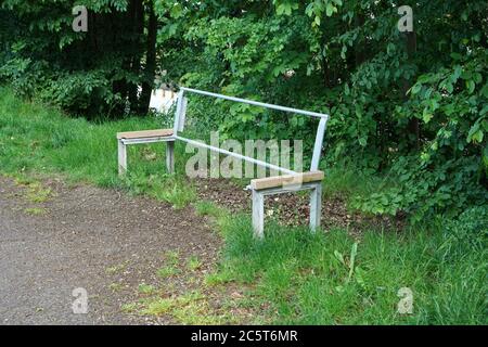 Benches and chairs at tables invite you to relax and unwind Stock Photo ...