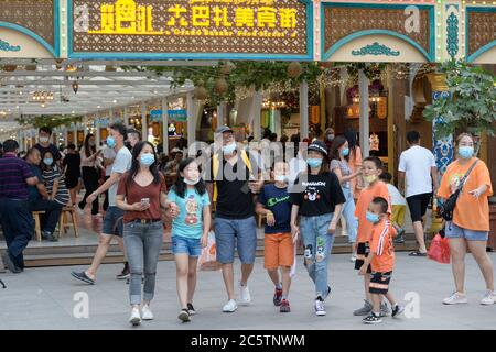 Tourists visit the Grand Bazaar in Urumqi City, northwest China's ...