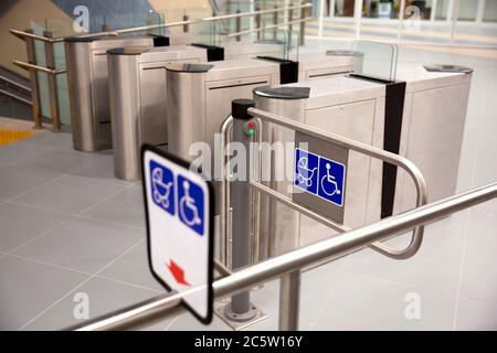Automatic access control ticket barriers or turnstile in subway station ...