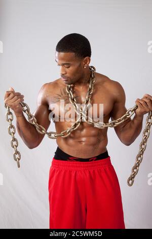 Fit black man with a chain Stock Photo - Alamy