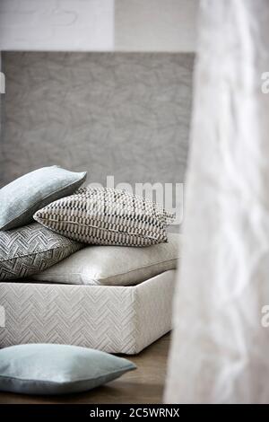 Comfortable sofa with different pillows in the room, unfocused Stock ...